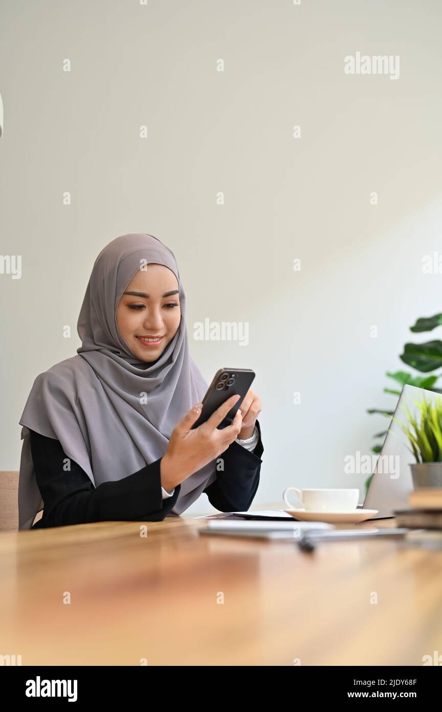 Beautiful muslim businesswoman or female executive manager wearing ...