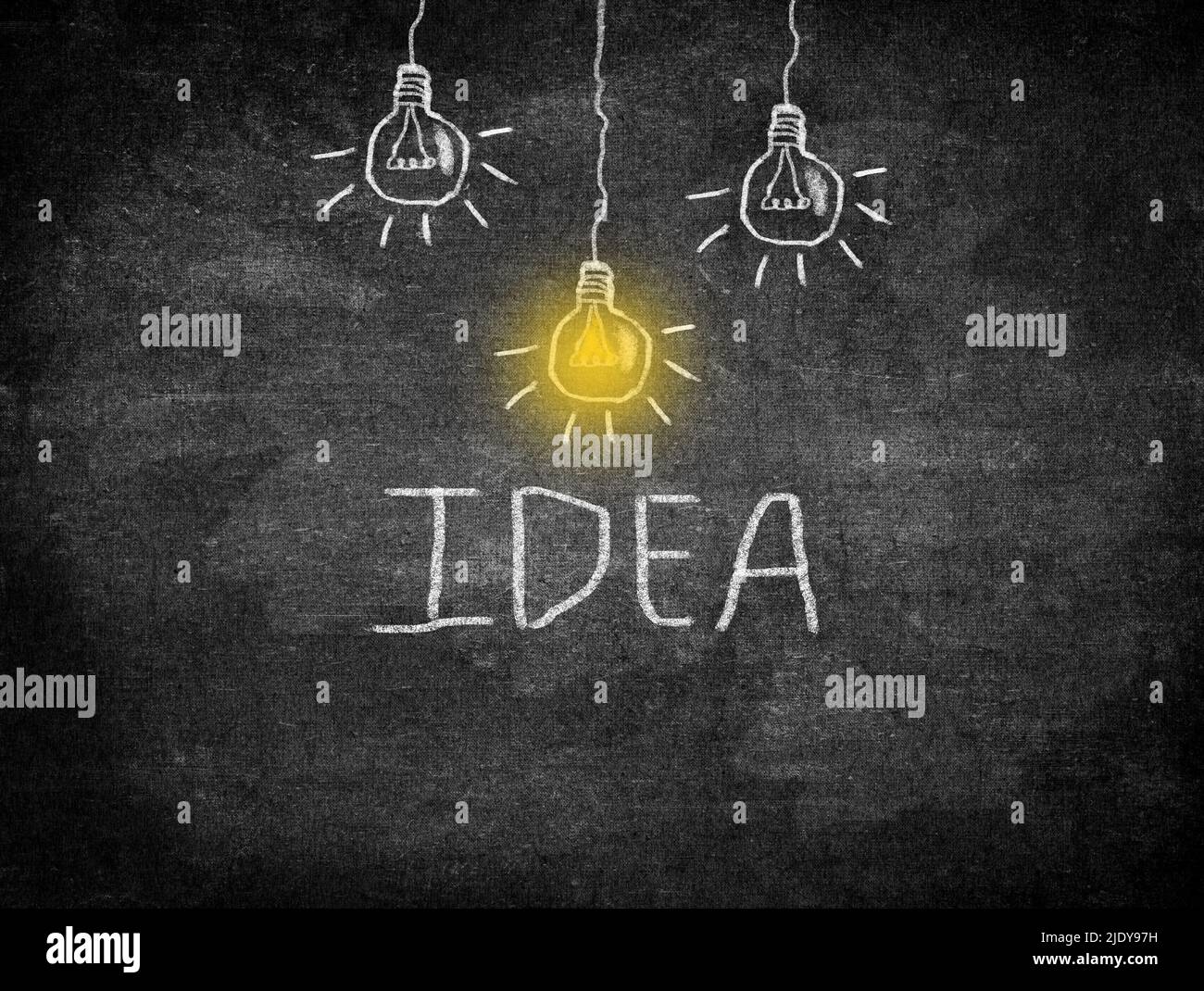 Hand drawing chalk bulb and word idea on blackboard.Creativity and ...