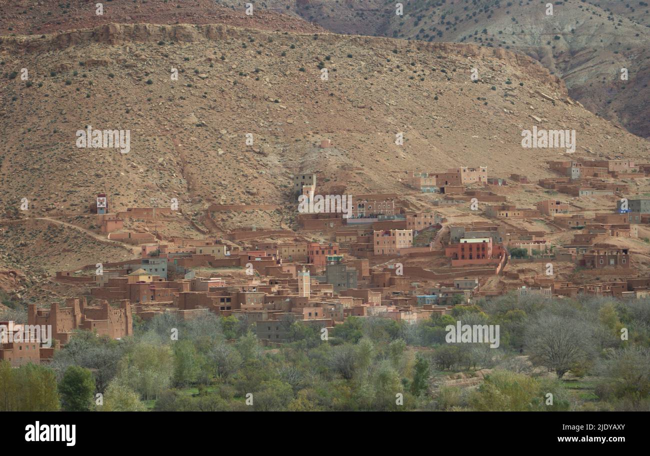 mudbrick village built in the side of the hill in the High Atlas ...