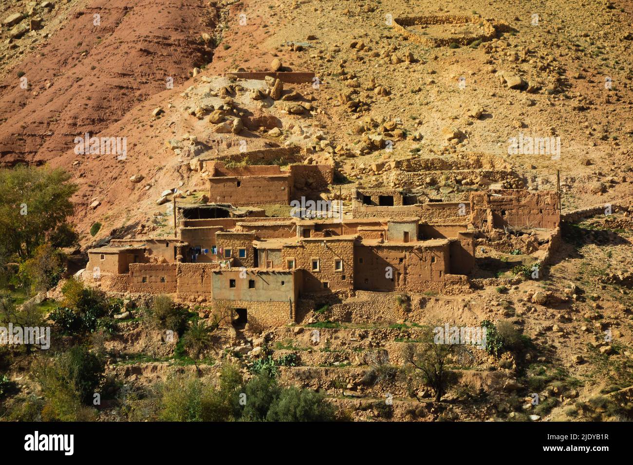 mud-brick village in the High Atlas mountains with a clear blue sky ...