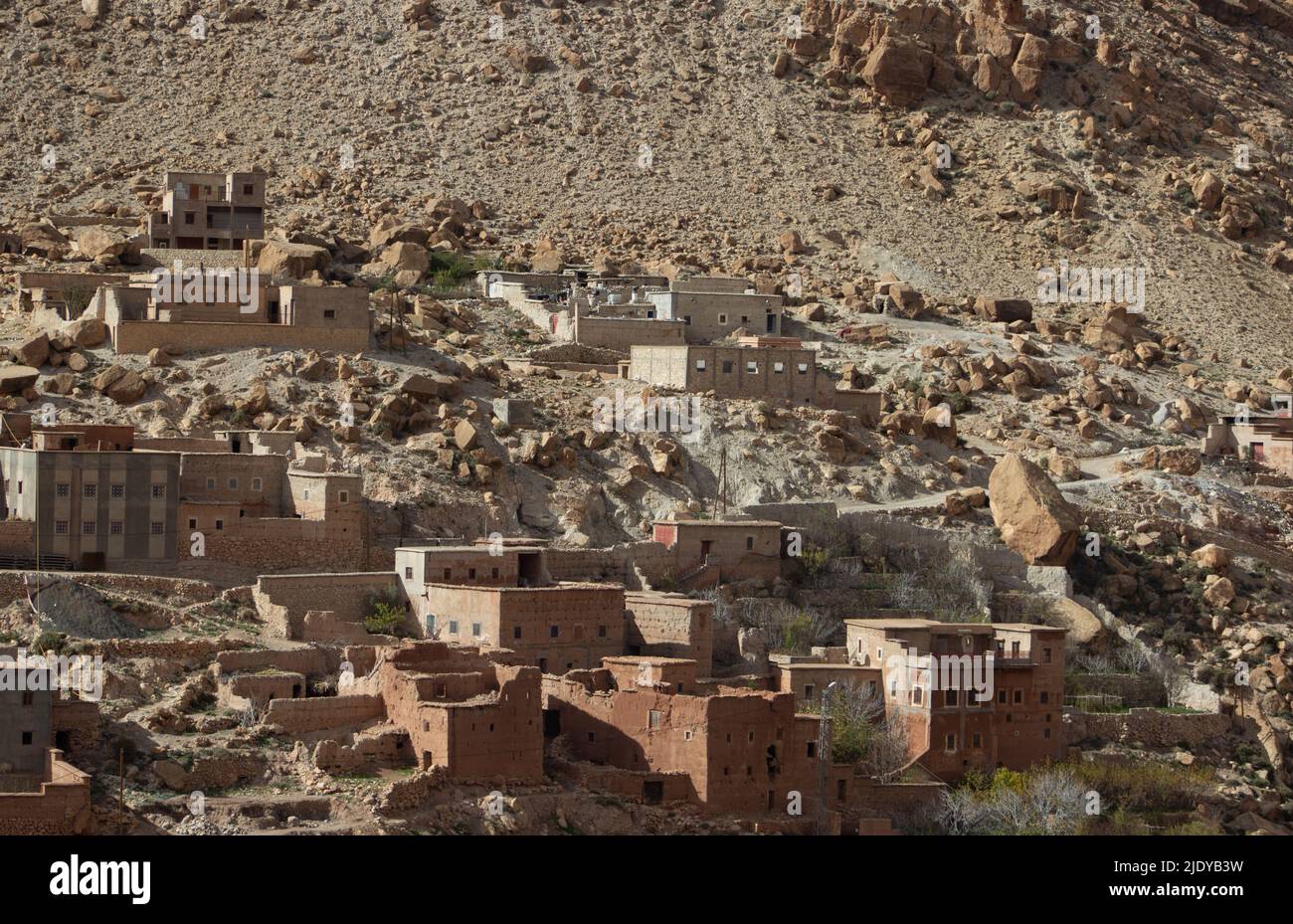mudbrick village in the High Atlas mountains with large boulders and ...