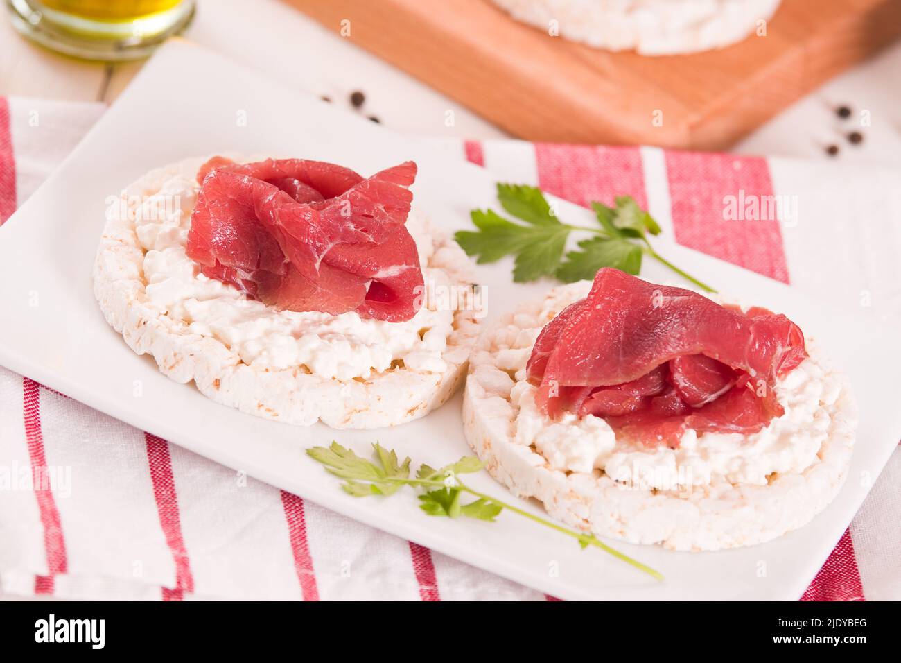 Rice cakes with milk flakes and cold beef Stock Photo - Alamy