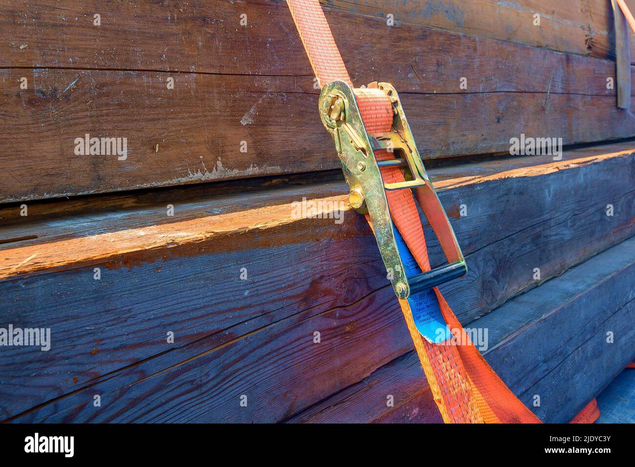 Cargo on a truck is secured by orange cargo straps Stock Photo - Alamy