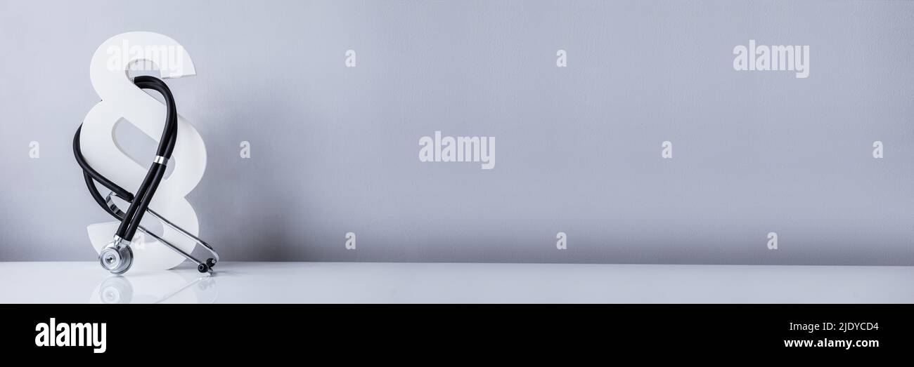 Close-up Of Stethoscope And Paragraph Symbol On Grey Background Stock ...