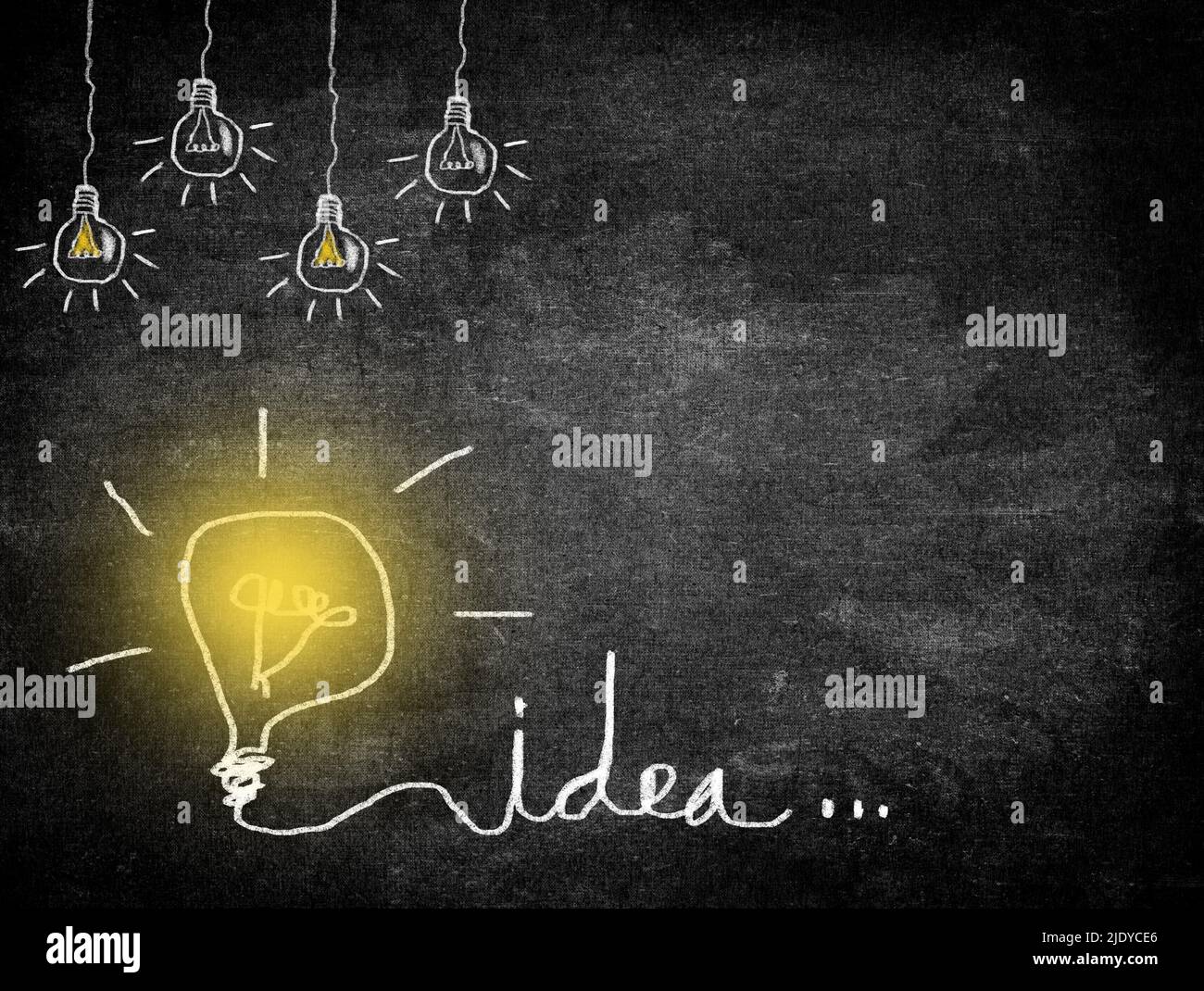 Hand drawing chalk bulb and word idea on blackboard.Creativity and ...