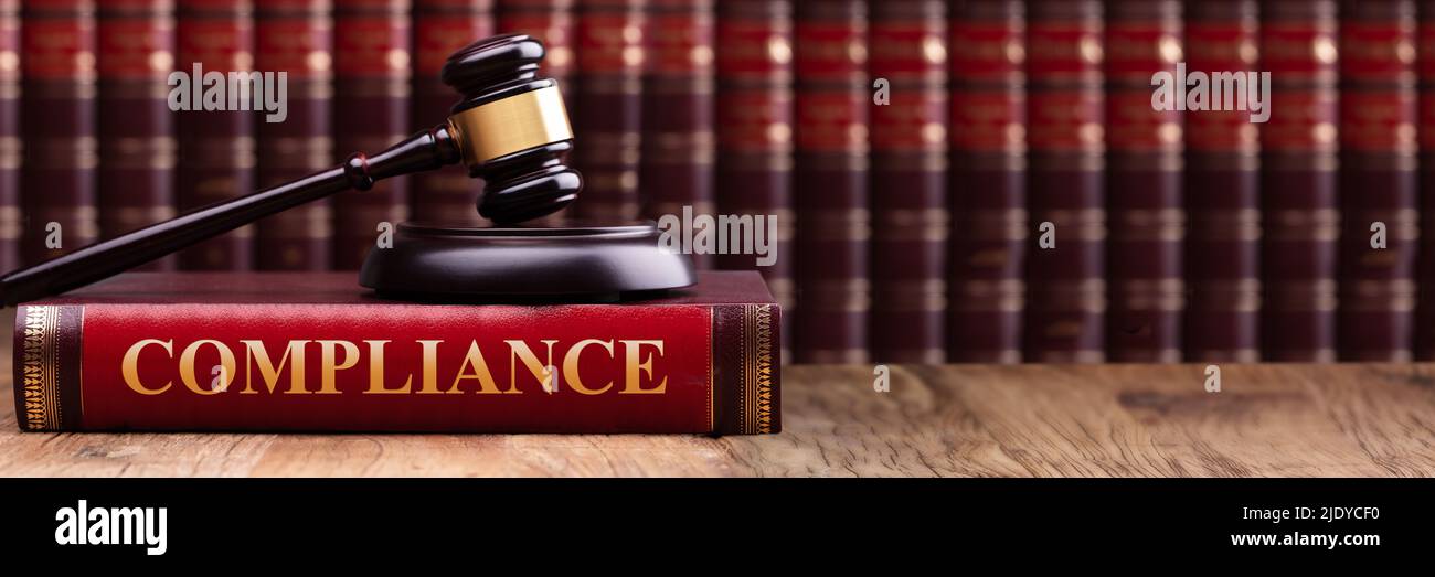 Wooden Judge Gavel And Soundboard On Compliance Law Book Stock Photo ...