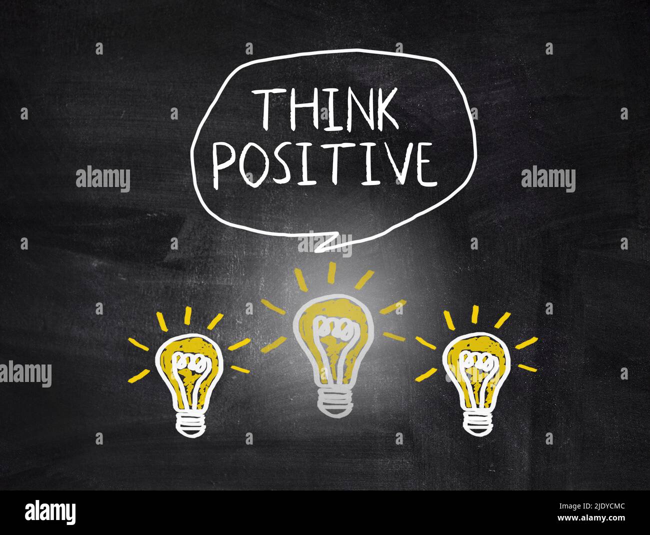 Think positive text and light bulbs on blackboard. concept with ...