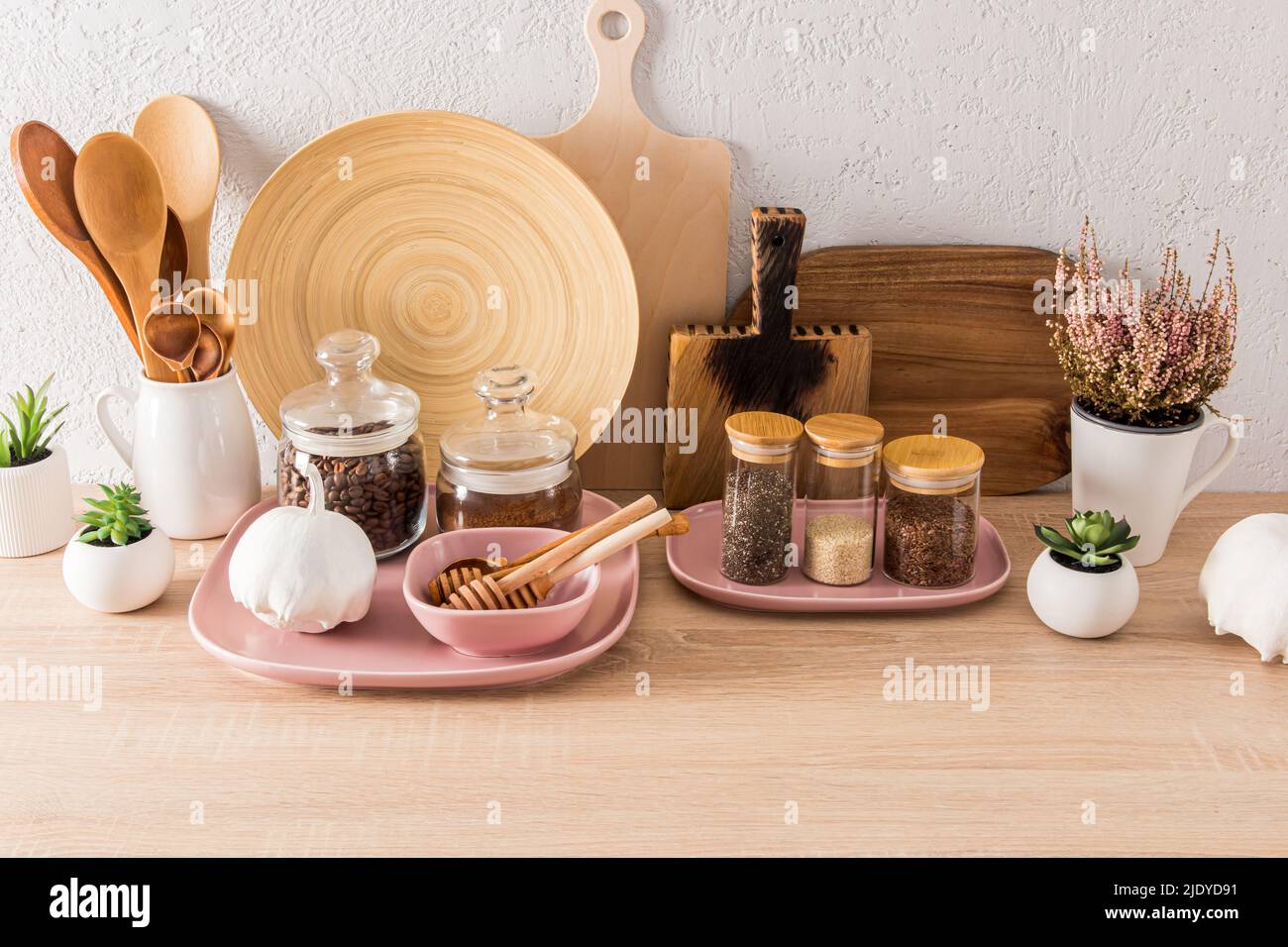 Lovely front view of various kitchen utensils. storage area for spices ...