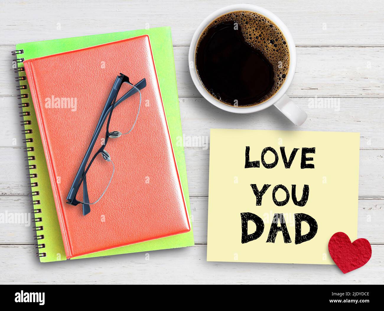 Love you dad letters written on sticky note and red heart,notebook,cup ...