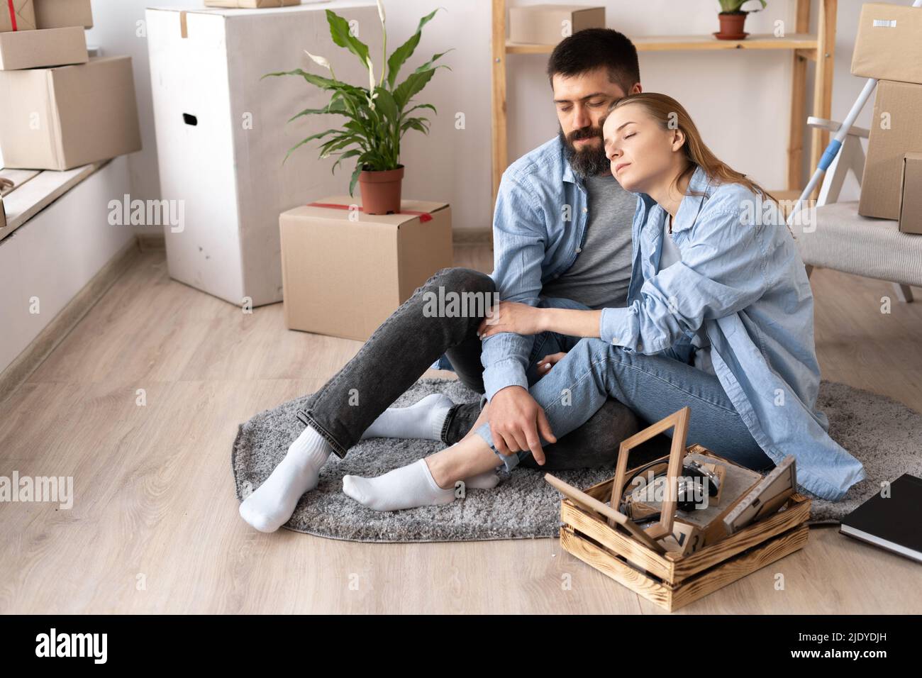 Couple hugs home surrounded hi-res stock photography and images - Alamy
