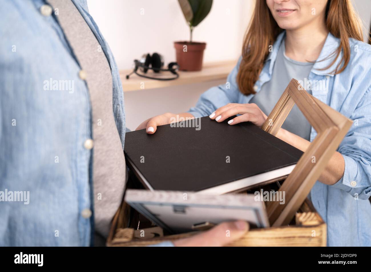 Couple in love packing their possessions into cardboard boxes, getting ...