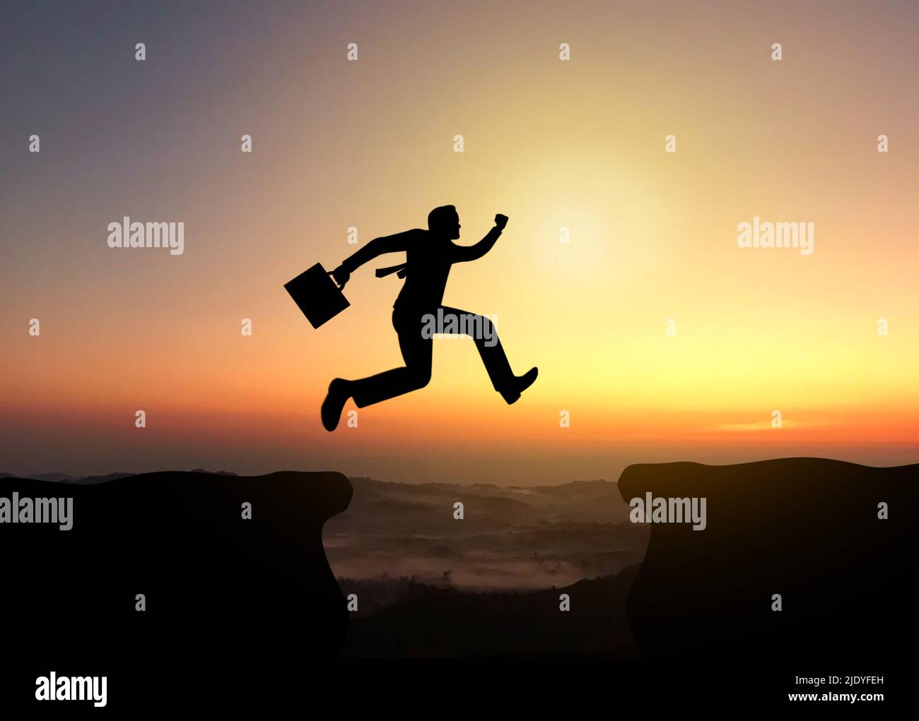 Businessman jumping to success silhouette, confident and winner or ...