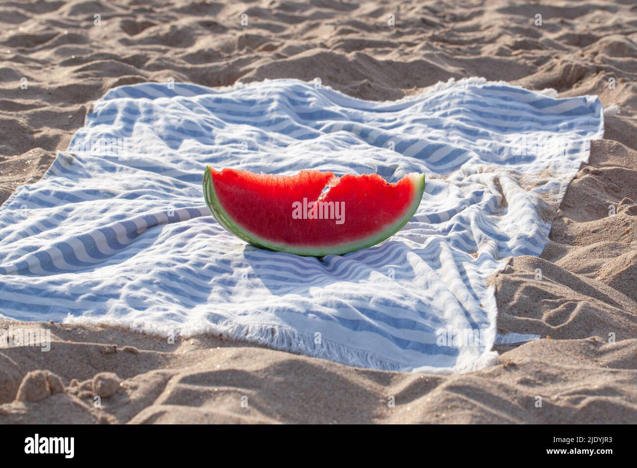 Slice of watermelon on the beach Stock Photo - Alamy