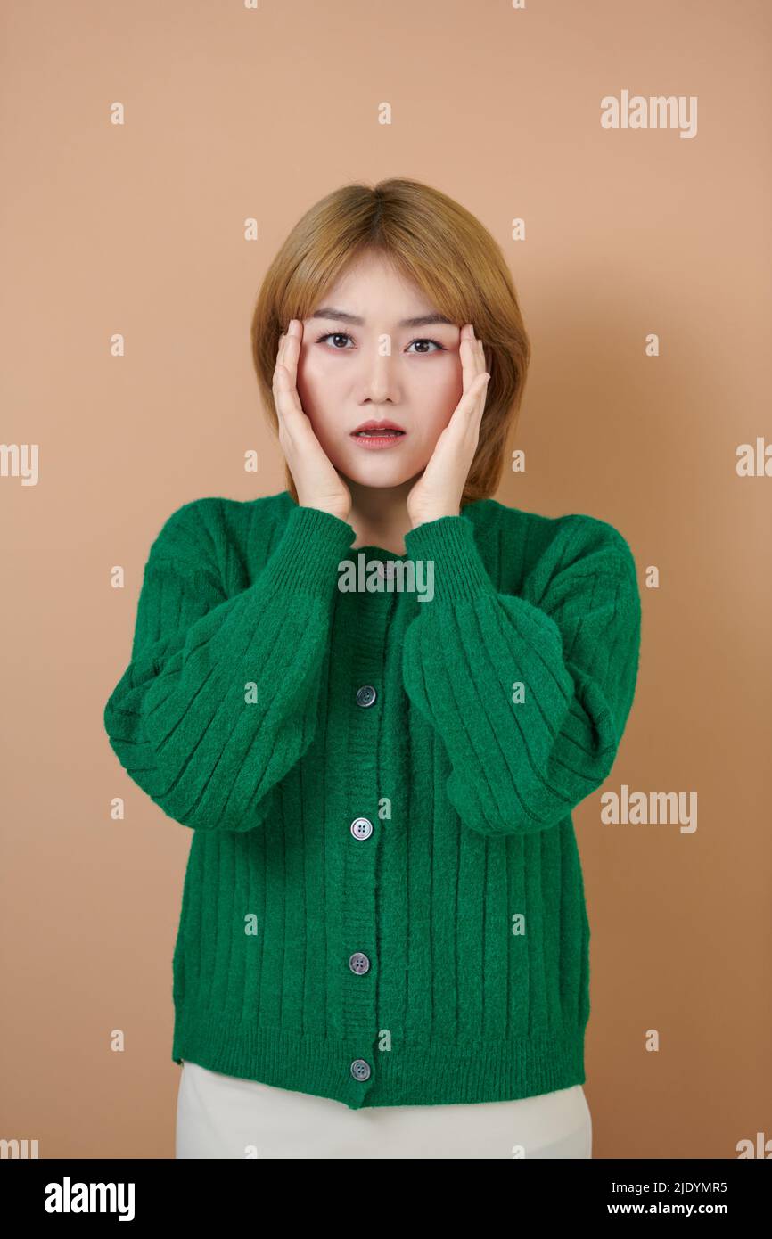 Control feelings. Doubtful lady suffering headache holding hands temple ...