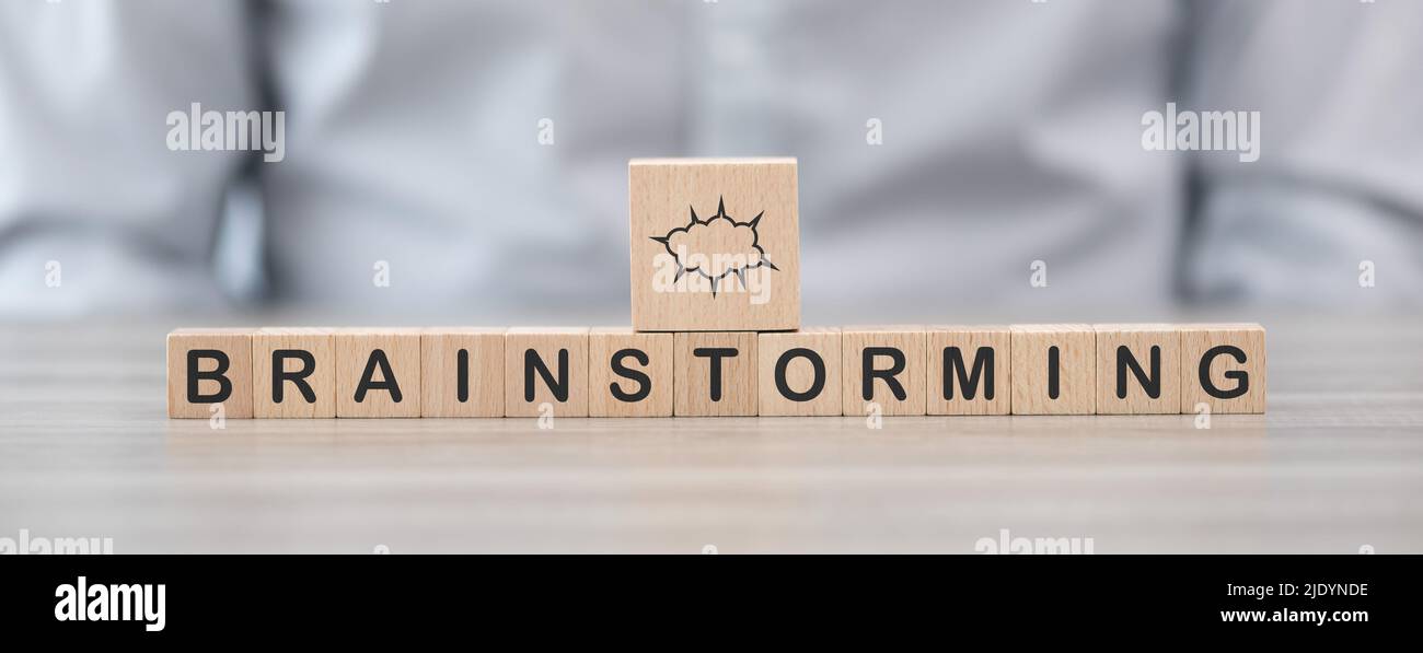 Wooden blocks with symbol of brainstorming concept Stock Photo - Alamy