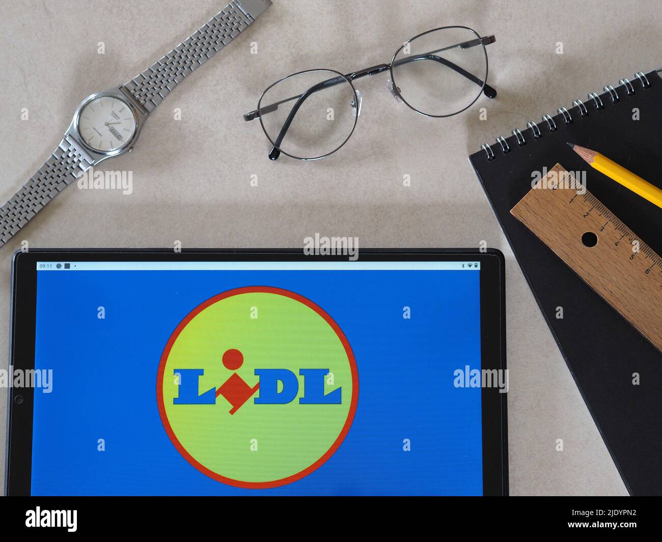 In this photo illustration Lidl logo seen displayed on a tablet Stock ...