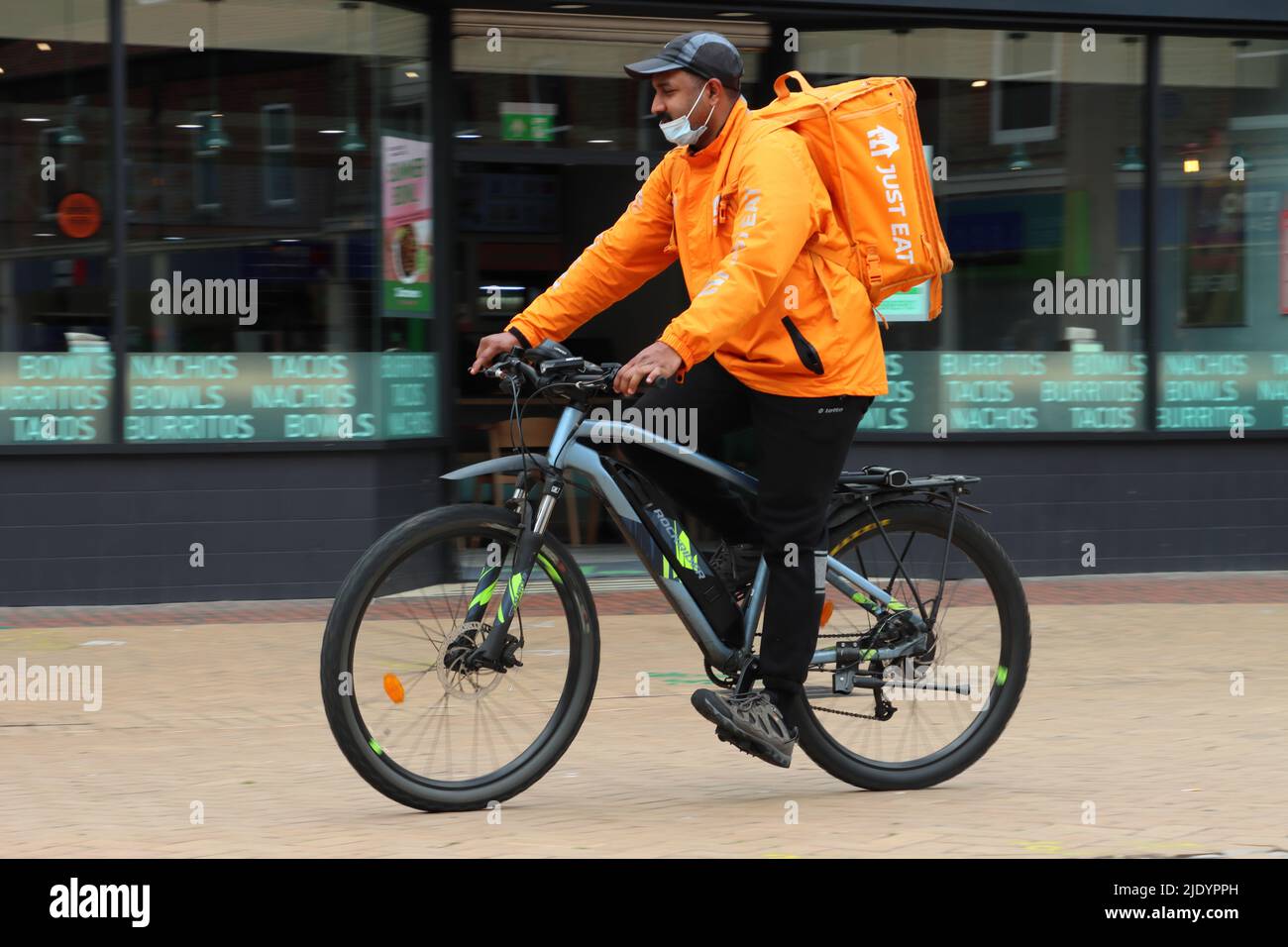 Just Eat delivery cyclist, High Street, Chelmsford, Essex, UK Stock ...