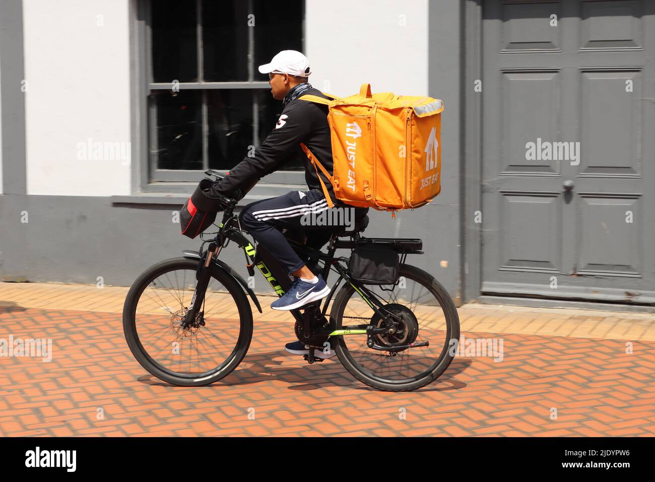Just Eat delivery cyclist, High Street, Chelmsford, Essex, UK Stock ...