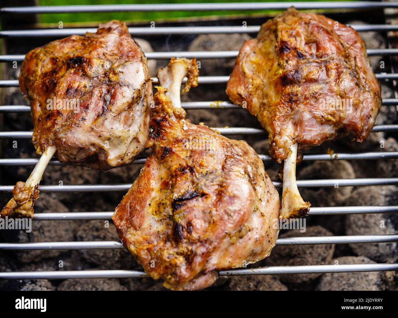 grilled pig wings - sliced open pork knuckle of a young pig Stock Photo ...