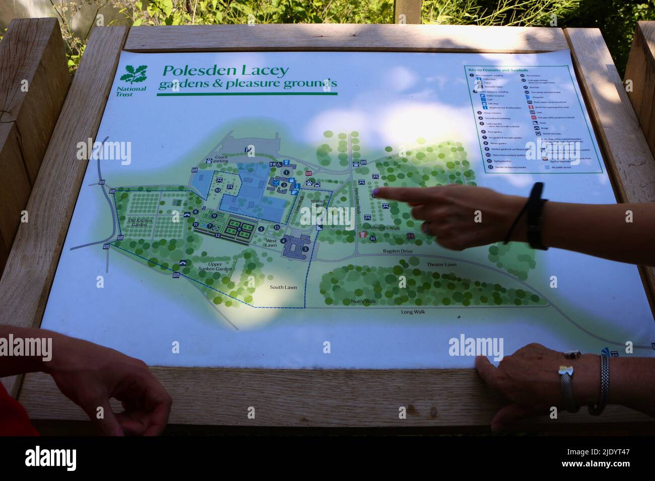 Pointing at a map of the grounds of Polesden Lacey Edwardian Estate ...