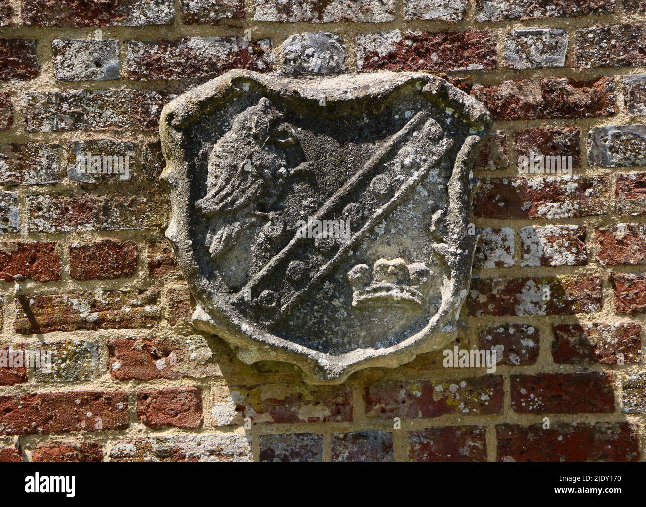 Close up of a stone coat of arms on a brick wall in the ornamental ...