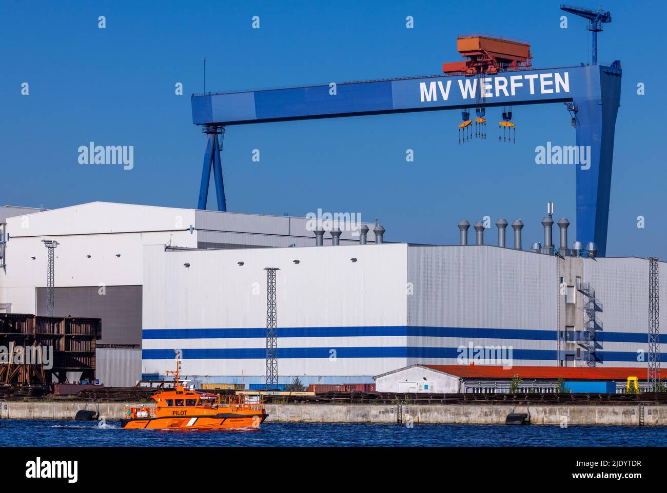 Rostock, Germany. 24th June, 2022. The pilot boat passes the MV ...