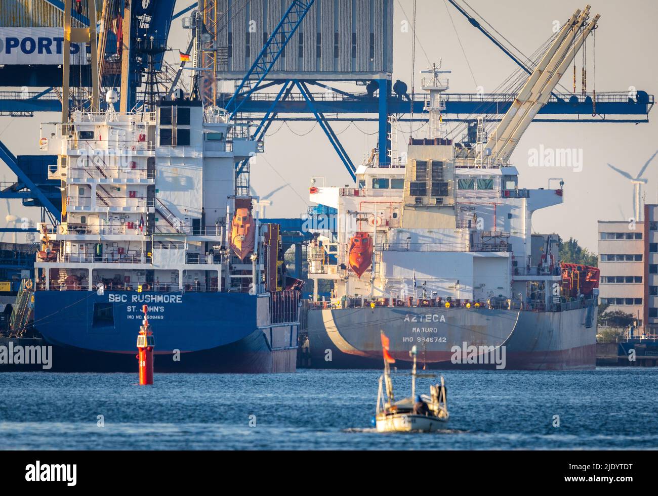 Rostock, Germany. 24th June, 2022. The cargo ships "BBC Rushmore" (l ...