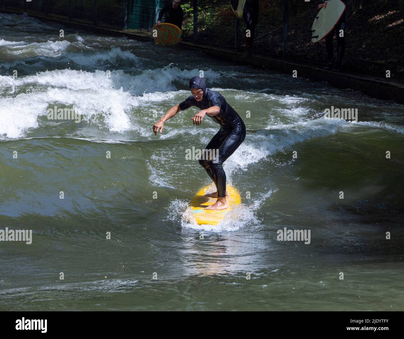 Surfer on the Eisbach river, English Garden city park, Munich, Germany ...