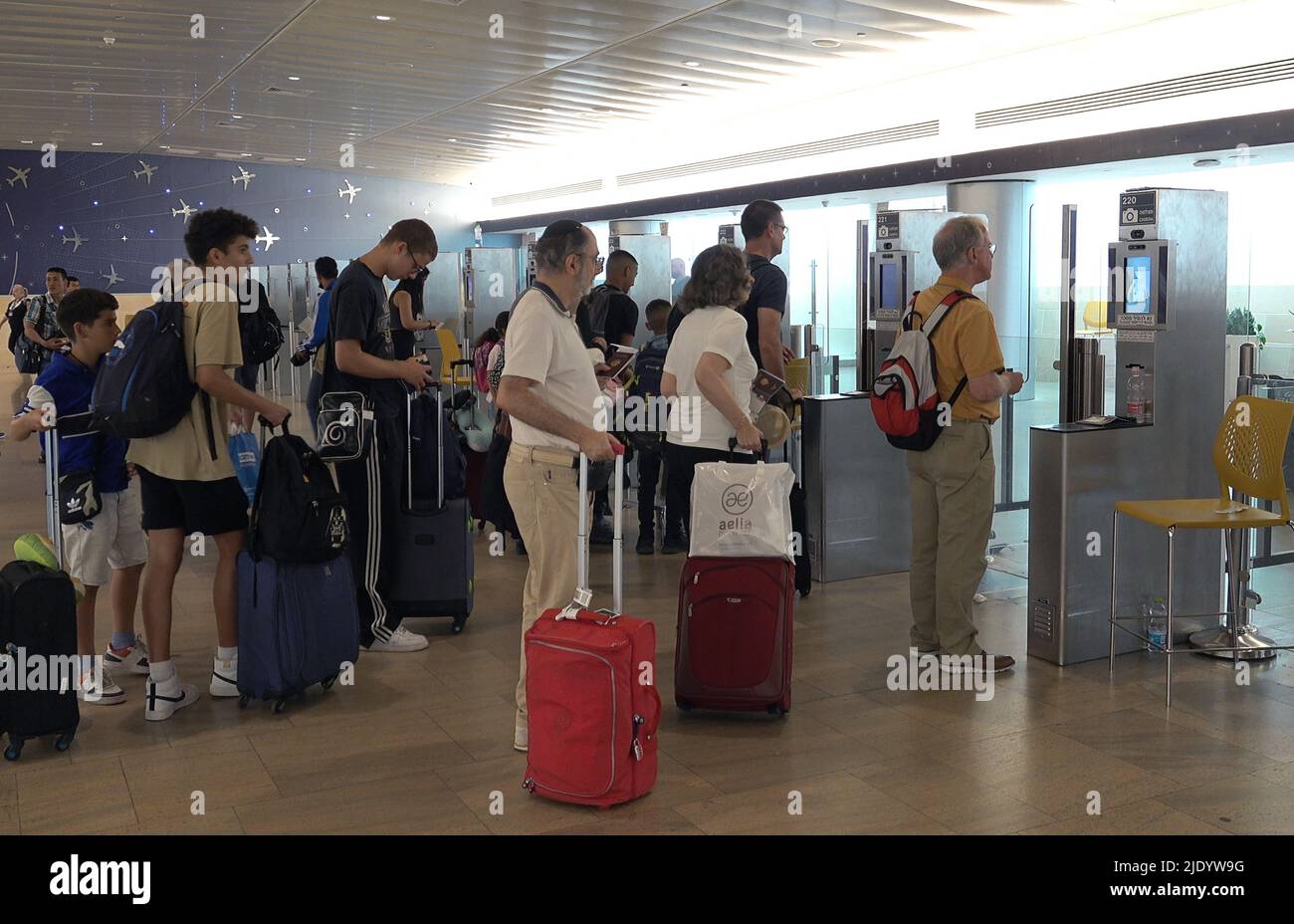Passengers pass through bio-metric passport control stands using facial ...