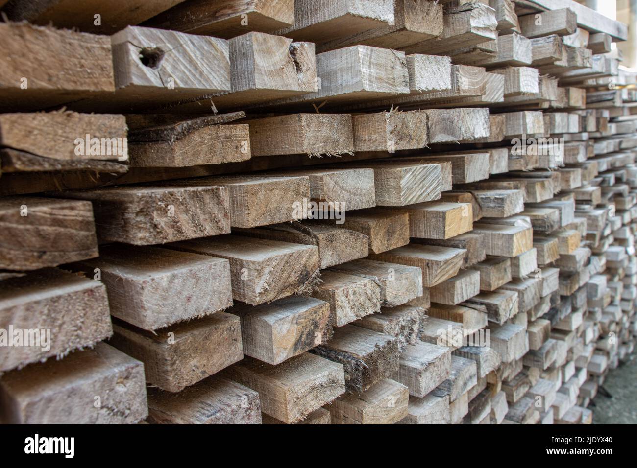 A pile of wooden planks ready for use on a construction site Stock ...