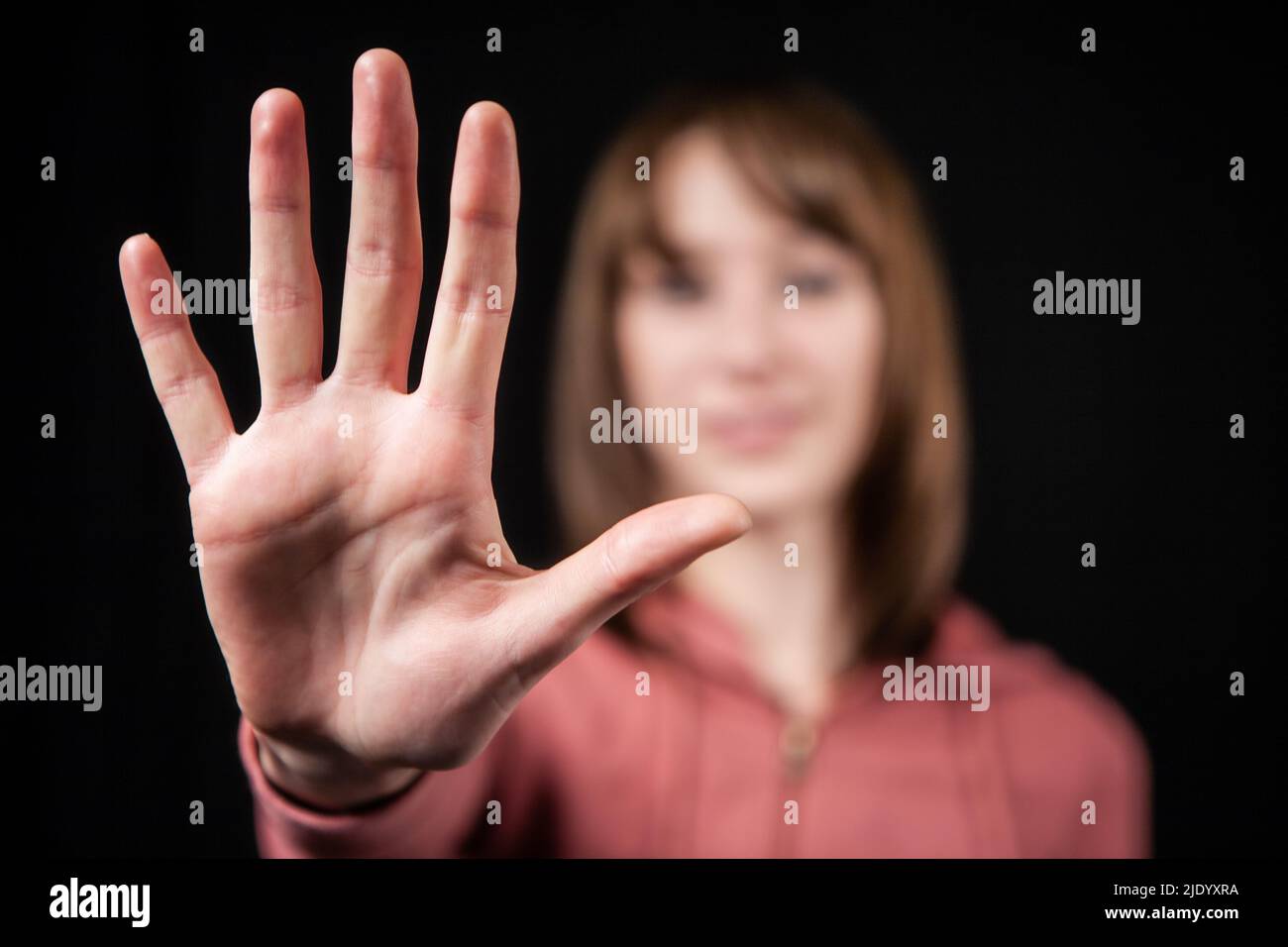 Taking control. Focus on the hand of a young woman making her decisions ...
