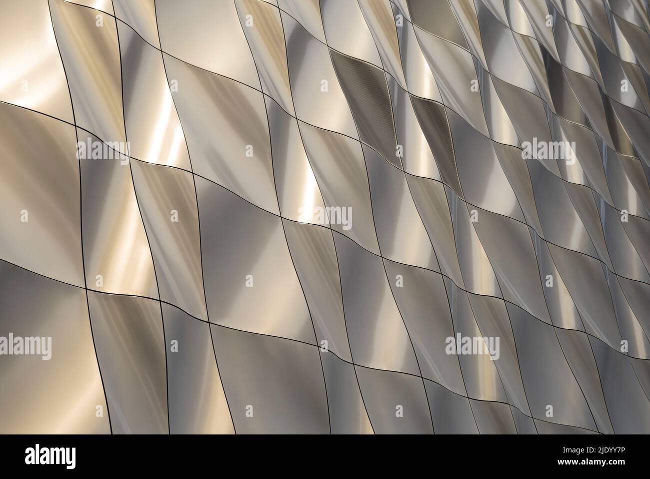 Sculptural, contemporary design, building clad in 3D formed, metal panels. Perforated panels ...