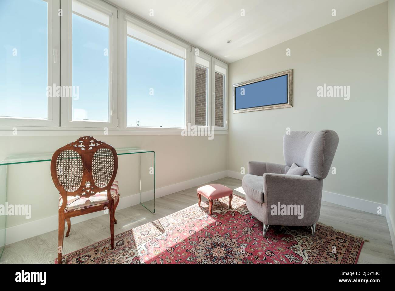 Rest and reading area in a room with a light wooden floor, large ...