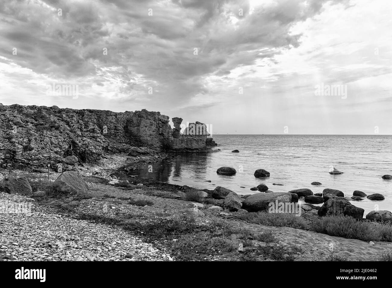 Rocky coast by the sea, Raukar on the east coast of Gotland, black and ...