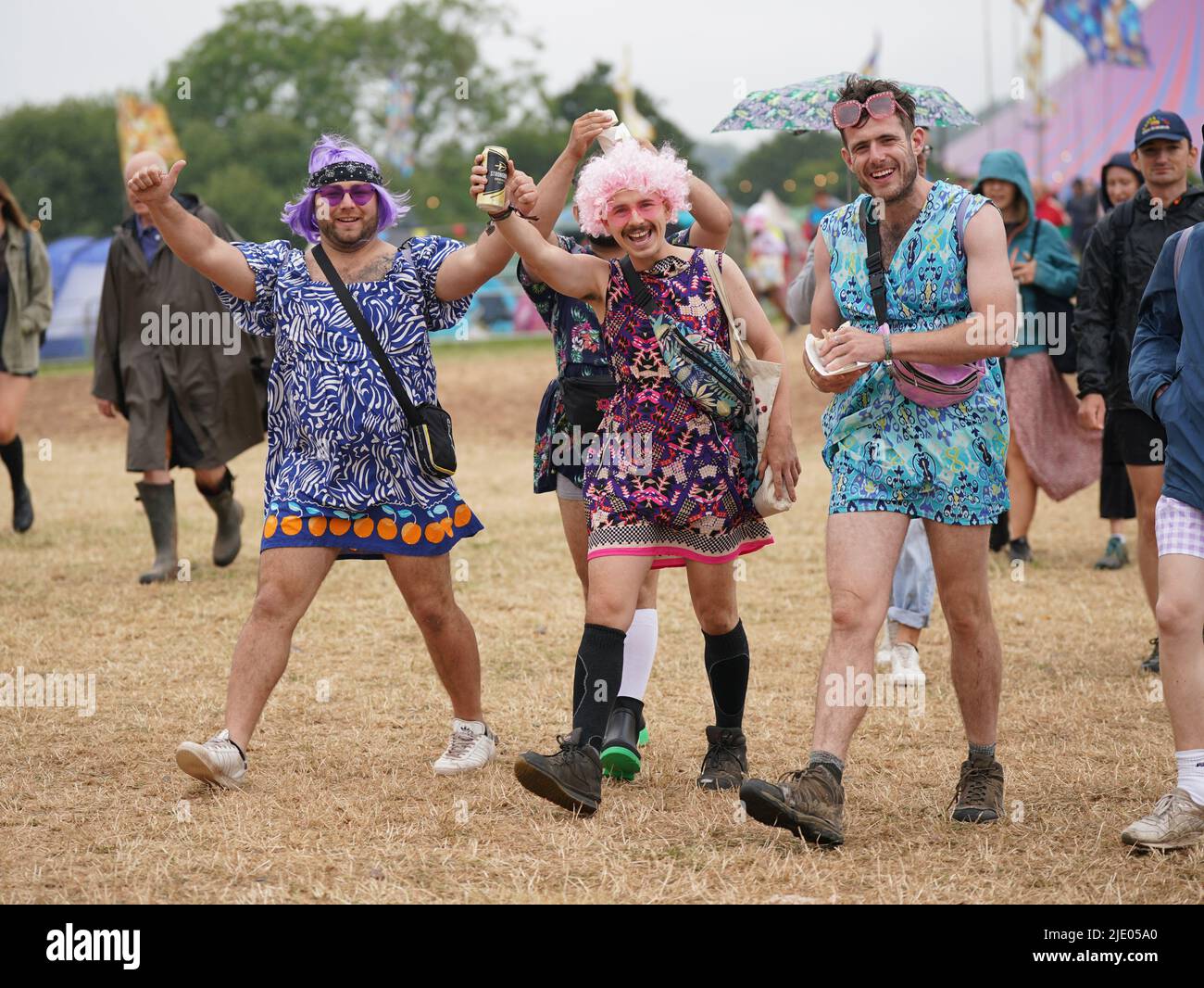 Festival goers in the rain during the Glastonbury Festival at Worthy ...