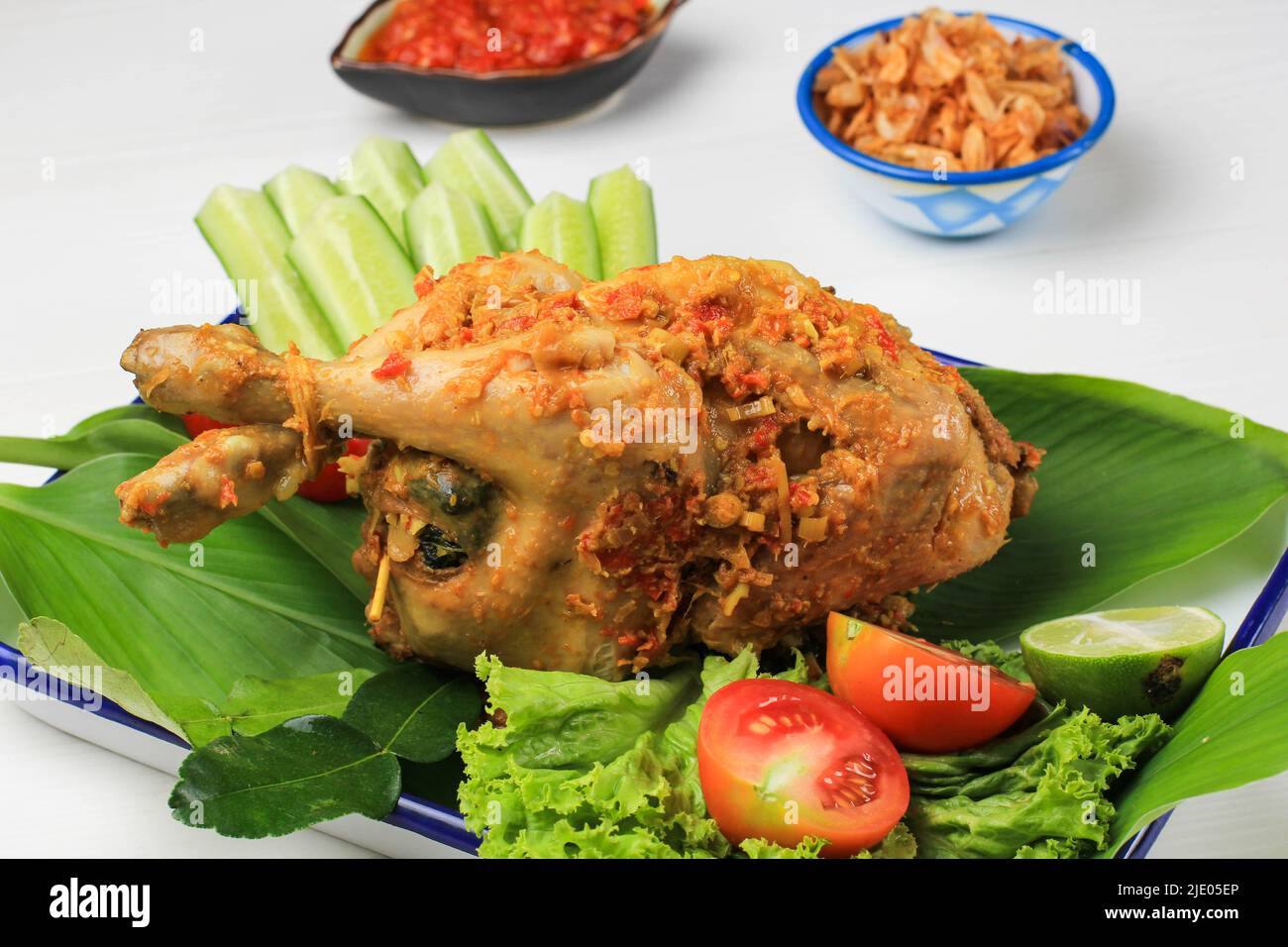 Ayam Betutu. Balinese Roast Chicken Stuffed with Cassava Leaves Stock ...