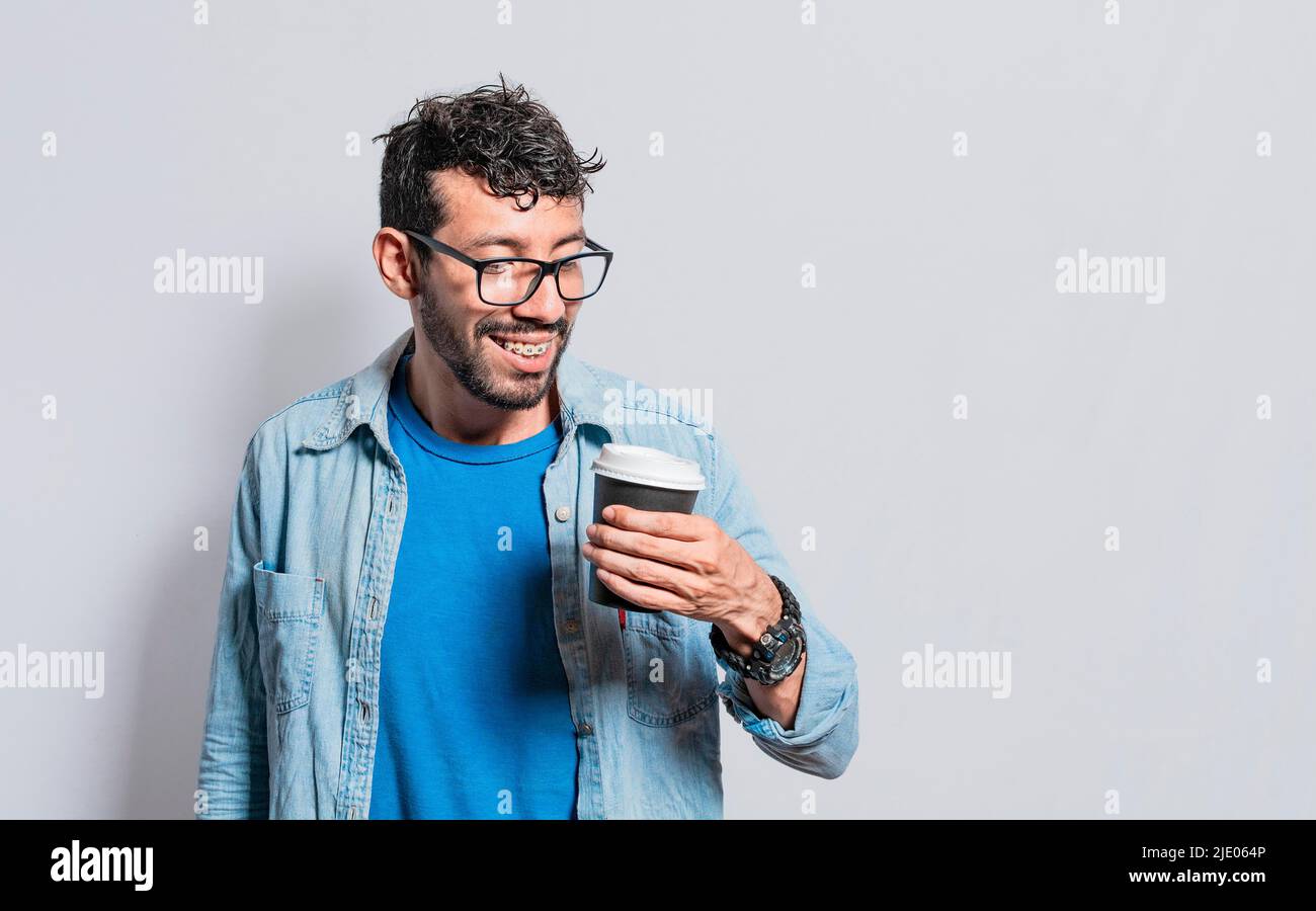 Excited person holding coffee glass on isolated background, Excited ...