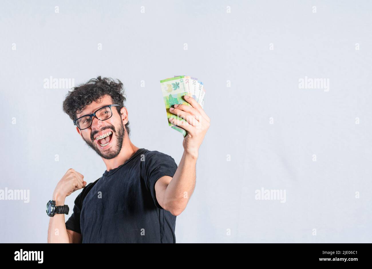 Excited man with money in hand, happy man holding banknotes in hand ...