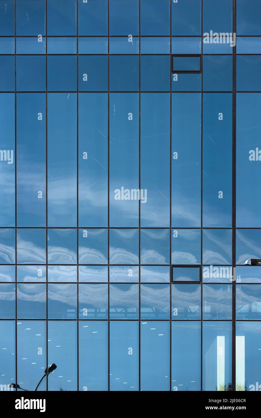 Texture of building windows with reflection Stock Photo - Alamy