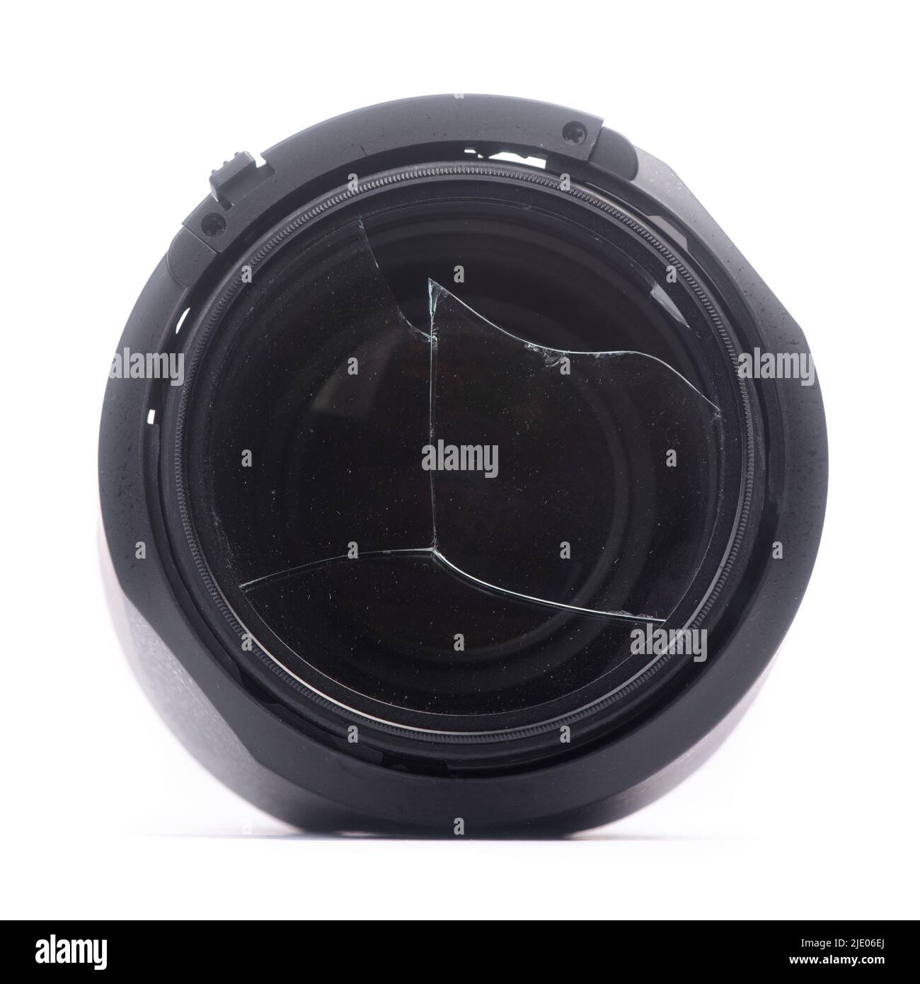 Broken protective filter glass on DSLR camera lens isolated over white ...