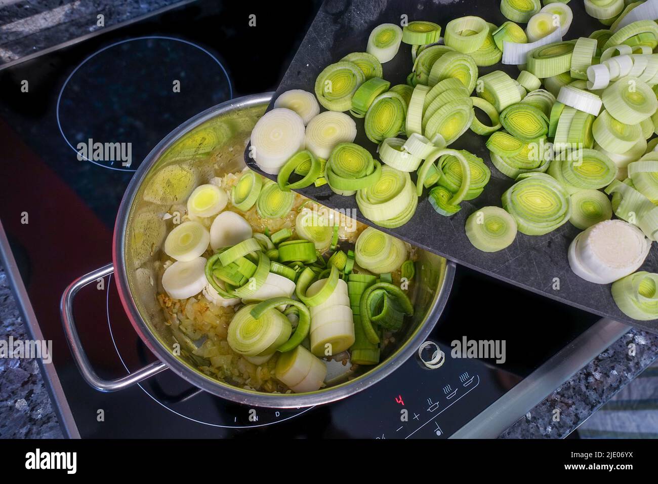 Swabian cuisine, preparing hearty oven sliders with leeks, sauteing ...