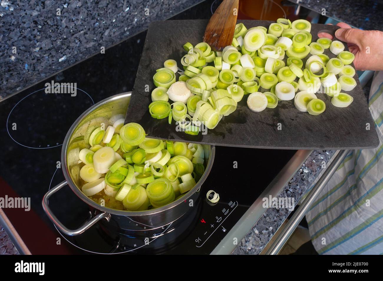 Swabian cuisine, preparing hearty oven sliders with leeks, sauteing ...