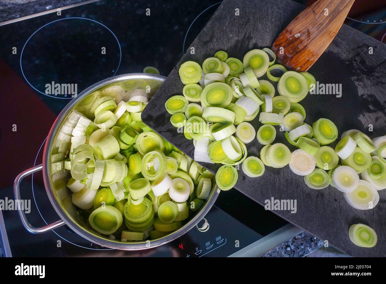 Swabian cuisine, preparing hearty oven sliders with leeks, sauteing ...