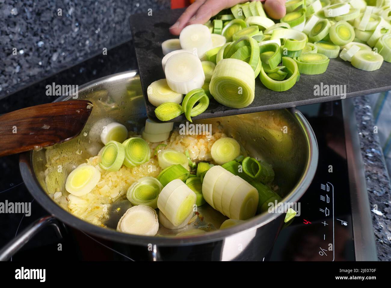 Swabian cuisine, preparing hearty oven sliders with leeks, sauteing ...