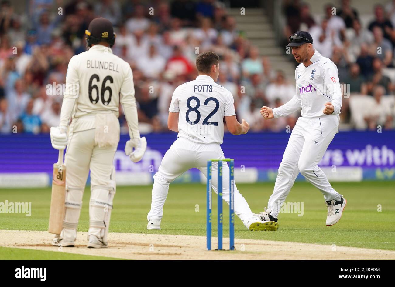 England's Matthew Potts (centre) celebrates the wicket of New Zealand's ...