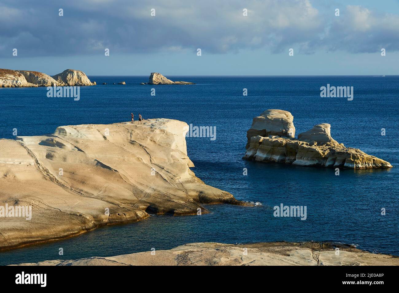 Morning light, tuff rock, tuff rocks, offshore islets, 2 people on ...