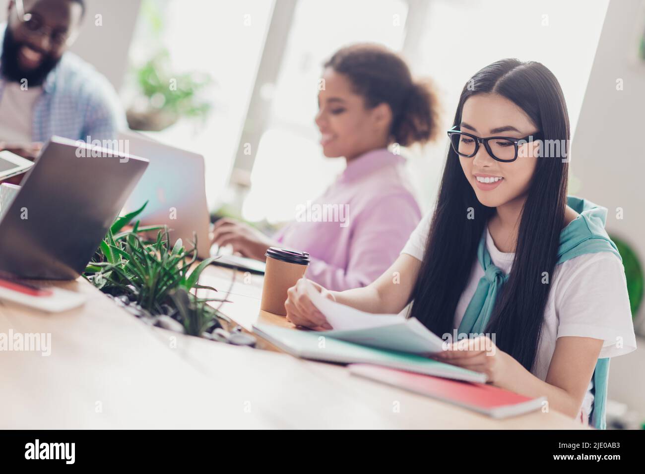 Photo of happy smiling businesswoman businessman reading working report ...