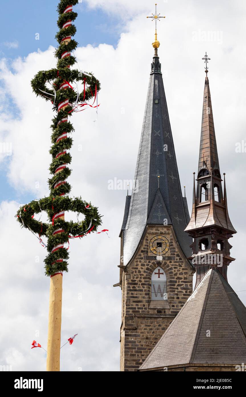Maypole on the main square with town parish church and town hall, Bad ...