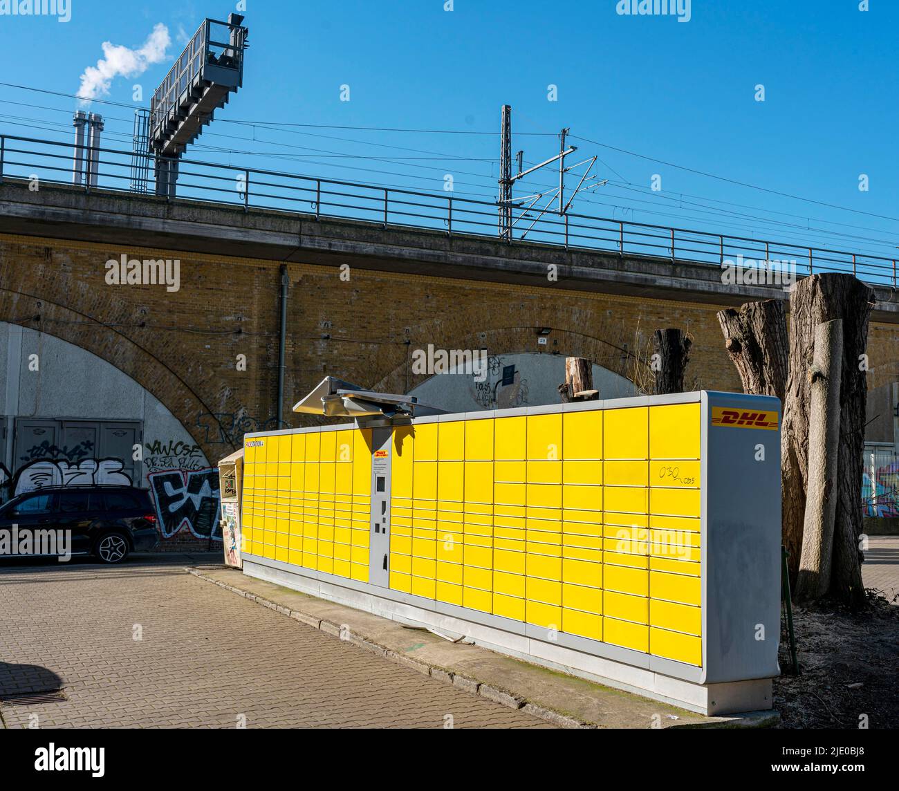 DHL packing station next to an S-Bahn line, Berlin, Germany Stock Photo ...