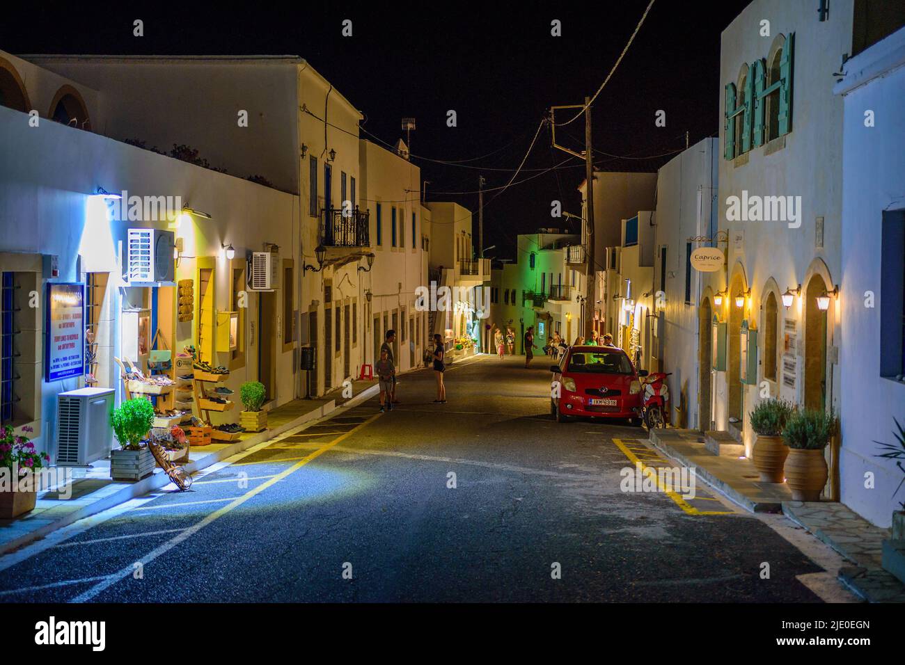 Architectural buildings with people walking in the streets of Chora ...